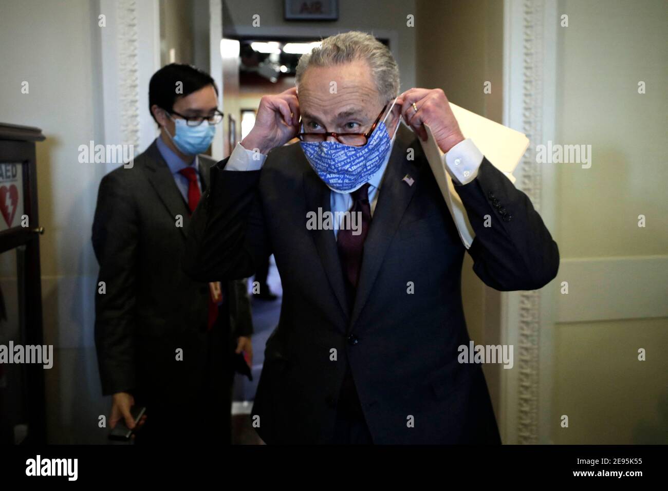 U.S. Senate Majority Leader Chuck Schumer (D-NY) wears a face mask ...
