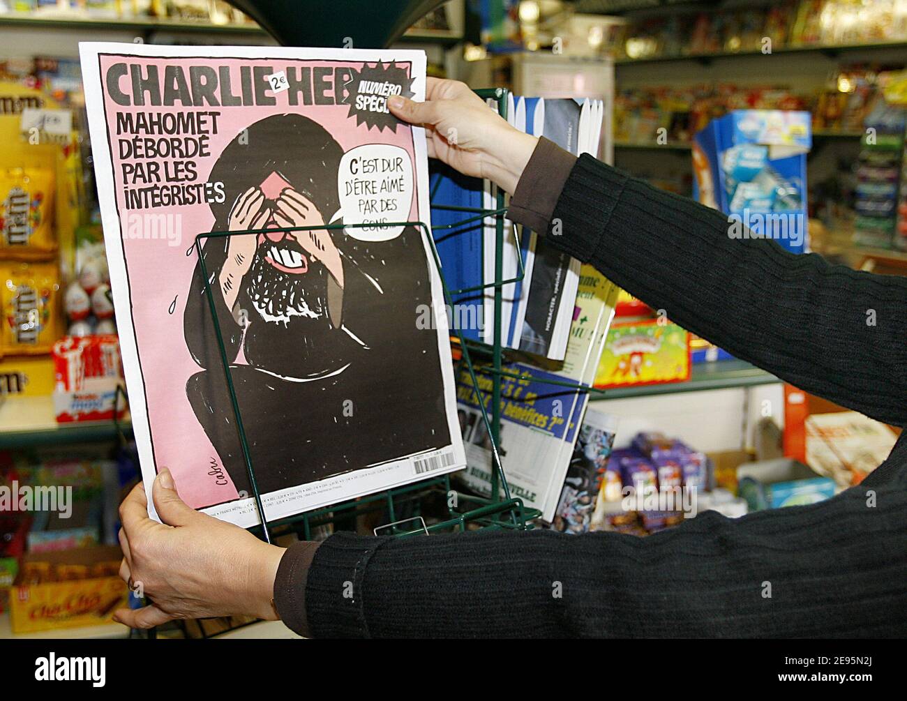 French satiric and humoristic magazine, Charlie Hebdo features all 12 ...