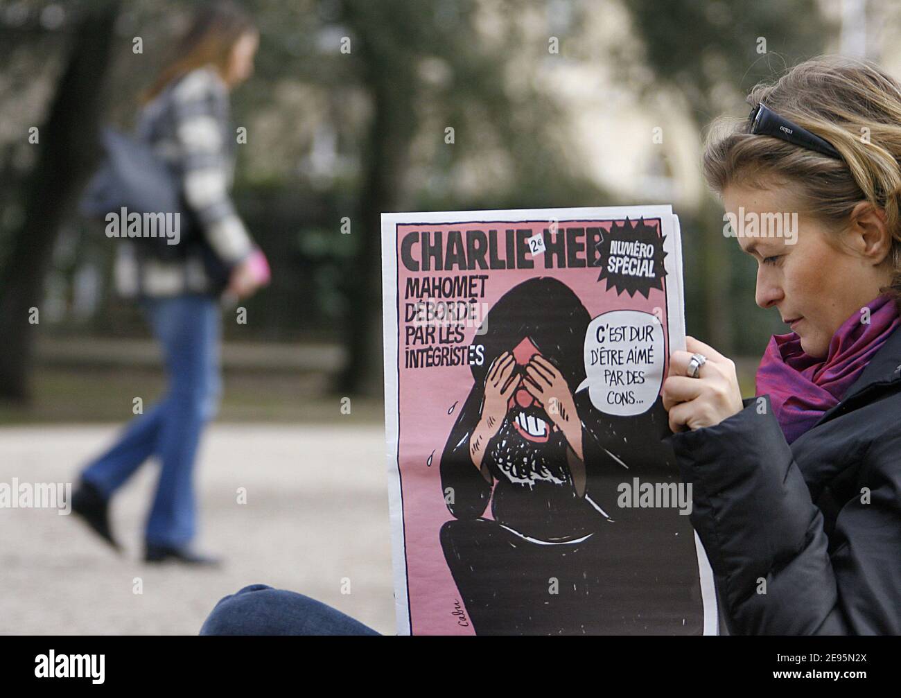 French satiric and humoristic magazine, Charlie Hebdo features all 12 ...