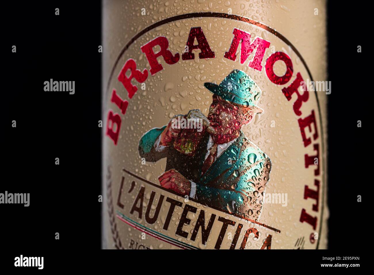 Birra Moretti, a premium lager beer with water droplets on black ...