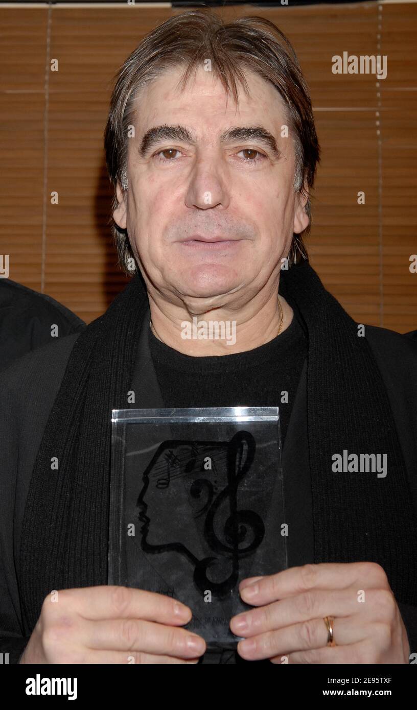 French singers Serge Lama, winner of Sacem UNAC prize 2006, poses with ...