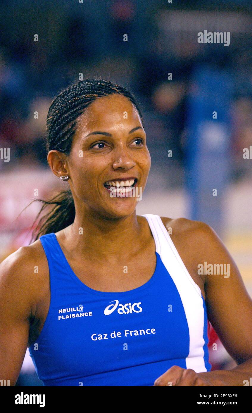 France's Christine Arron (C) competes during 60m sprint at the French ...