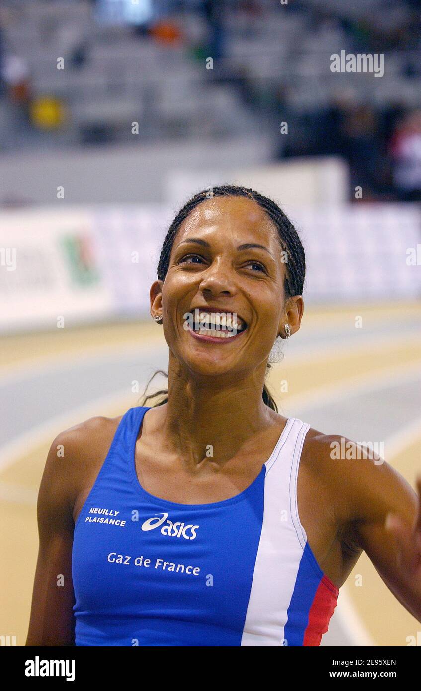 France's Christine Arron celebrates after winning the 60m final at the ...