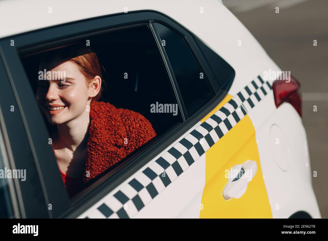 Young woman in back of taxi hi-res stock photography and images - Alamy
