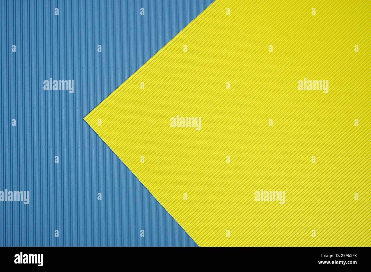 Blue and yellow two tone color paper background with stripes. Abstract ...