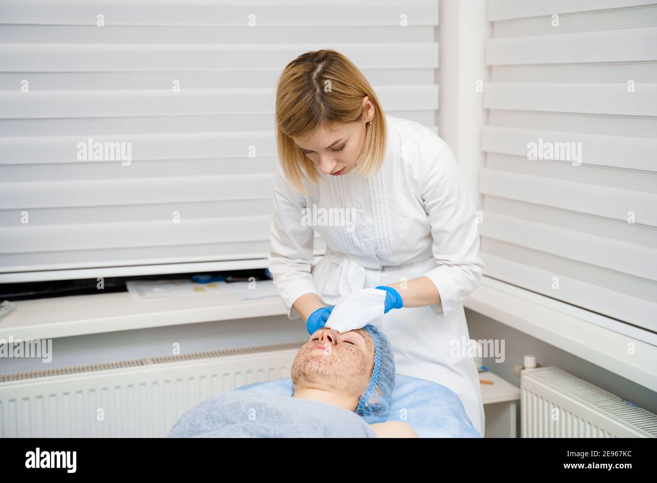 Skin cleaning by a beautician. Cosmetological procedures for women ...