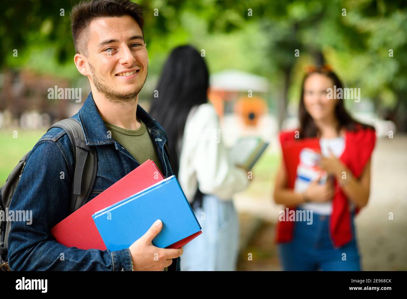 Happy male student outdoor smiling Stock Photo - Alamy