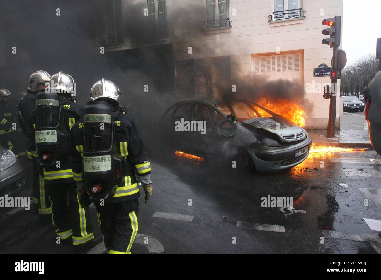 French firefighters fight a fire during a demonstration against the ...
