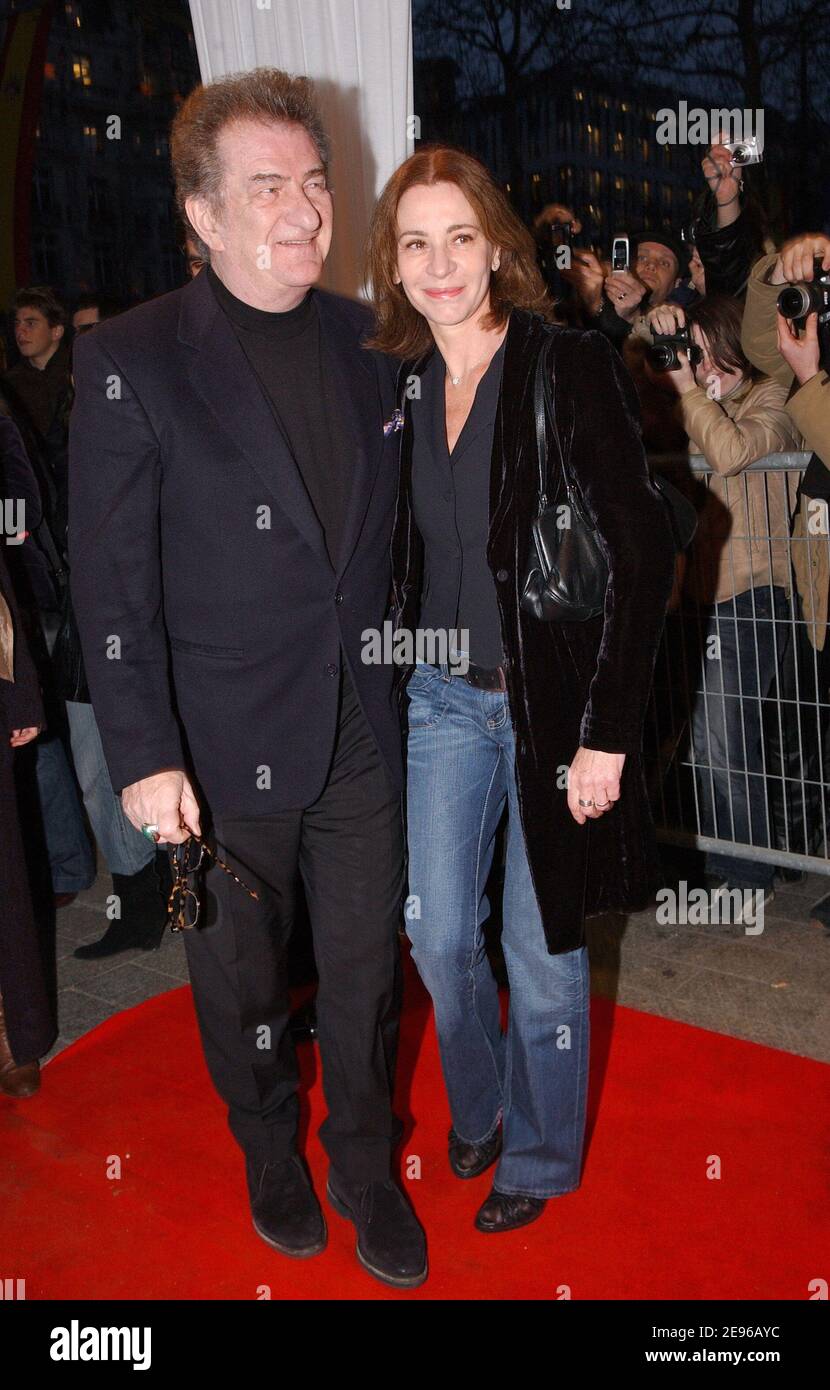 French singer Eddy Mitchell and his wife attend the premiere of 'Jean ...