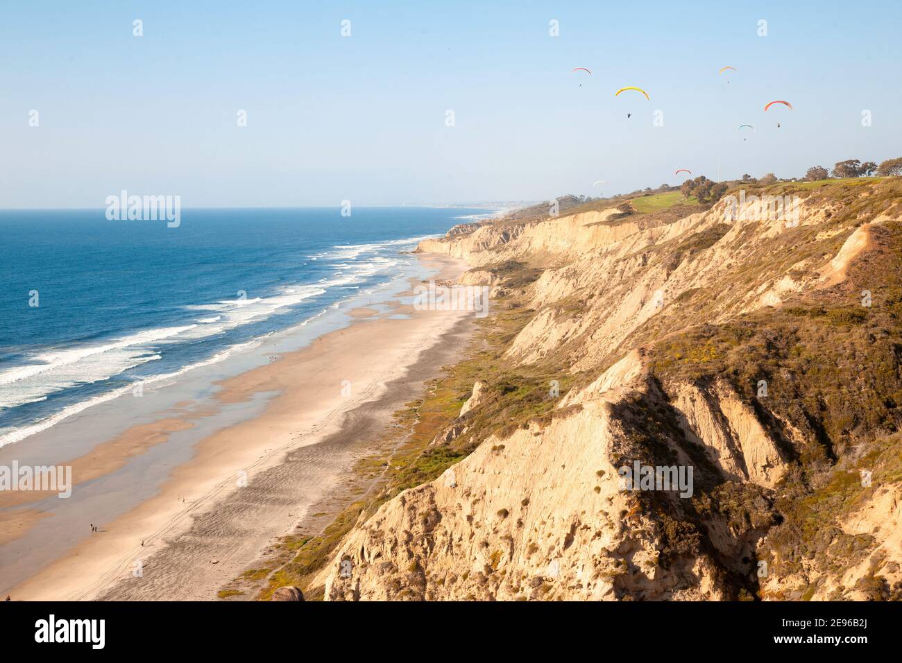 Beautiful beach landscape - yellow sandy and rocky beach with blue ...
