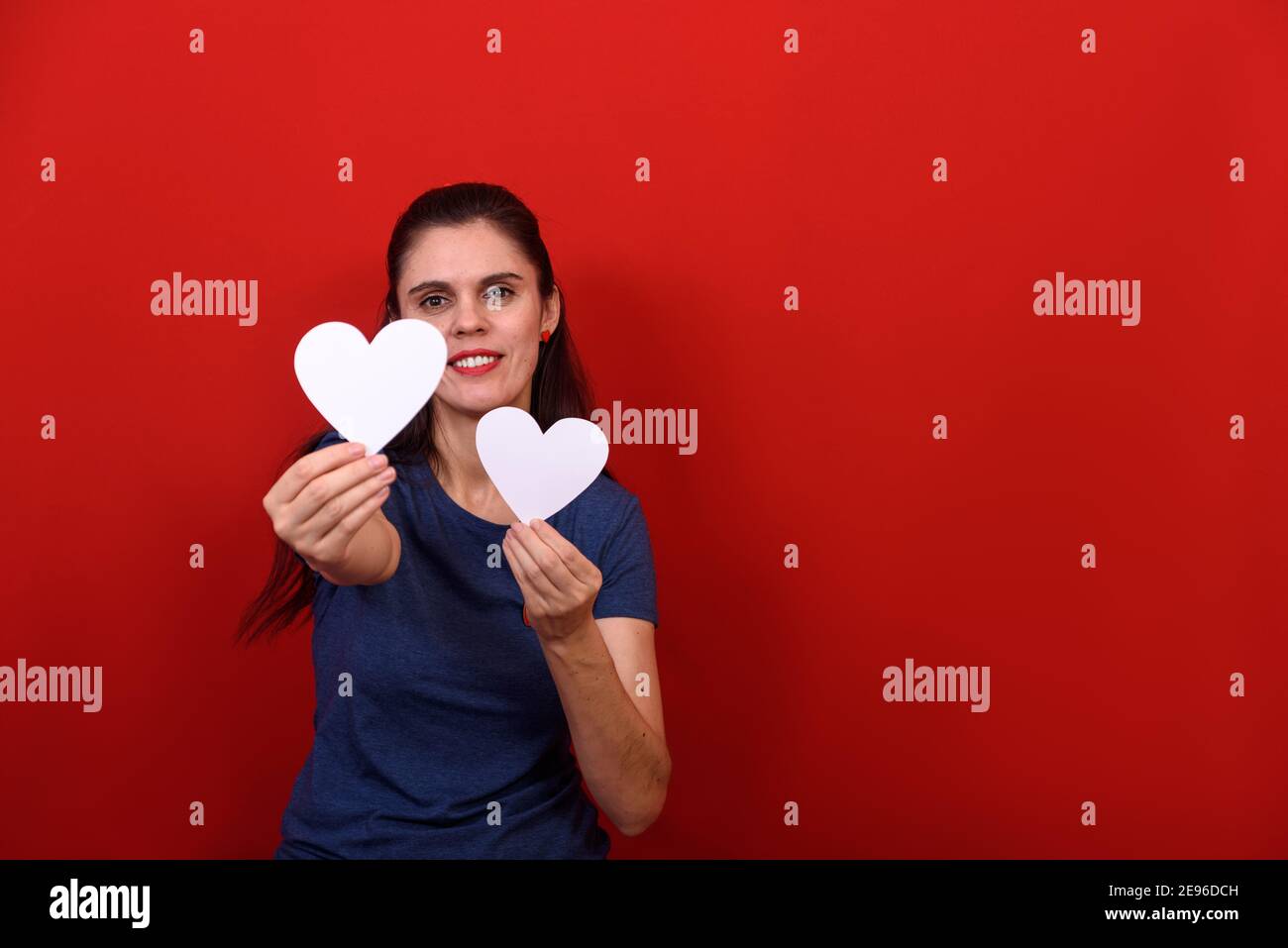 Adorable girl with valentines day heart showing love fun affection ...