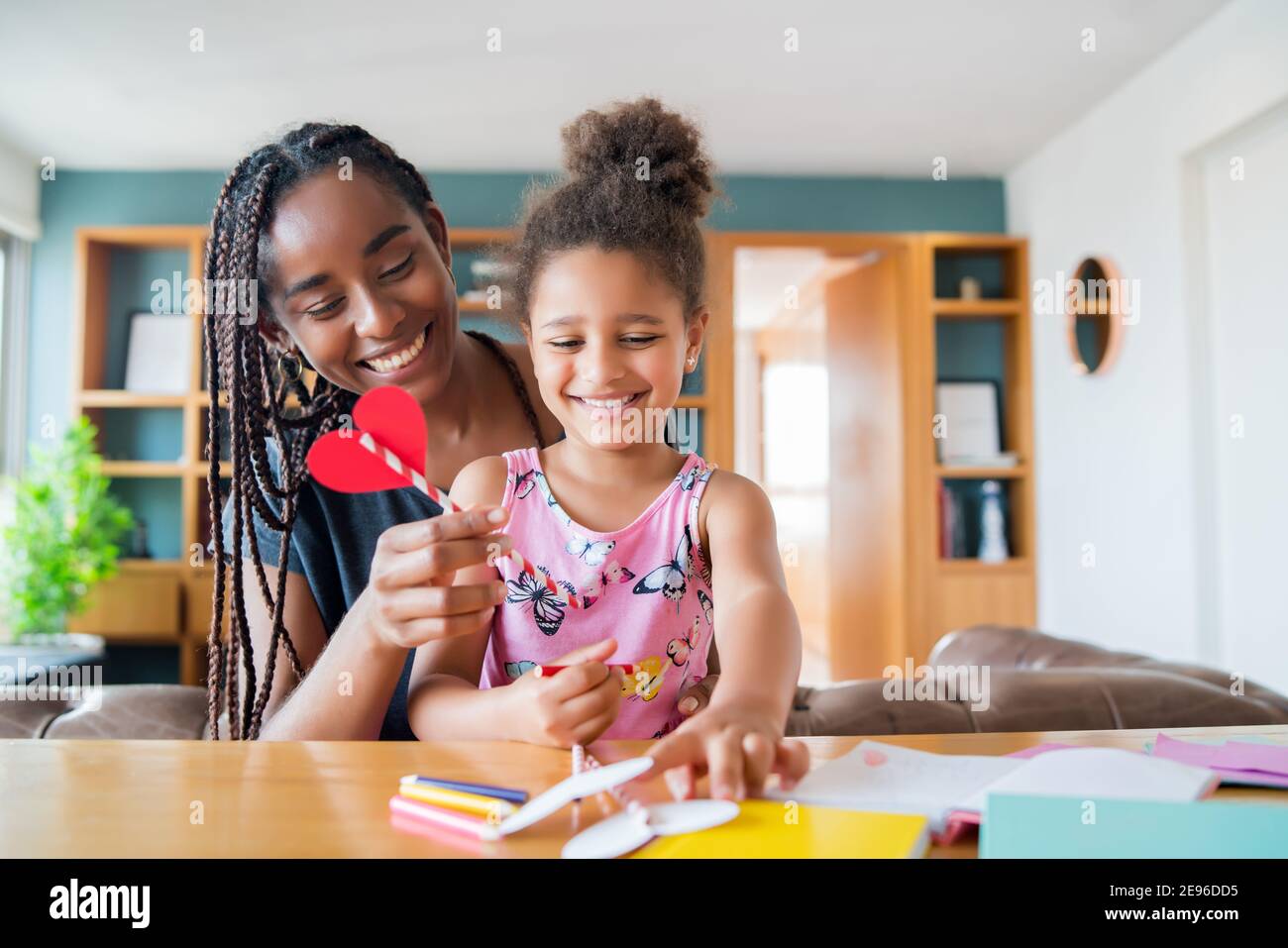 Portrait of a mother and her daughter smiling and spending time ...