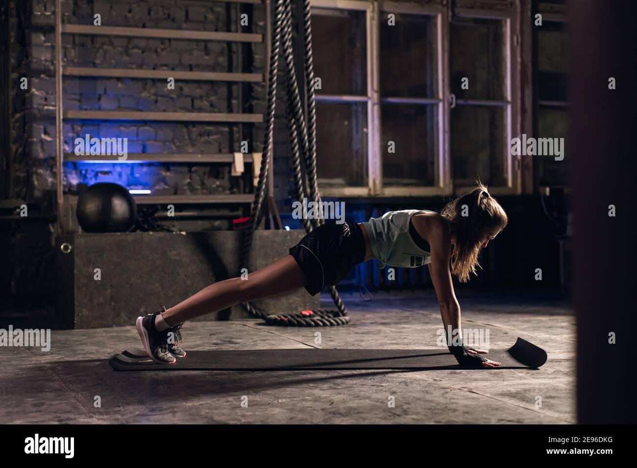 Young girl doing sports in the gym. Atmospheric gym Stock Photo - Alamy