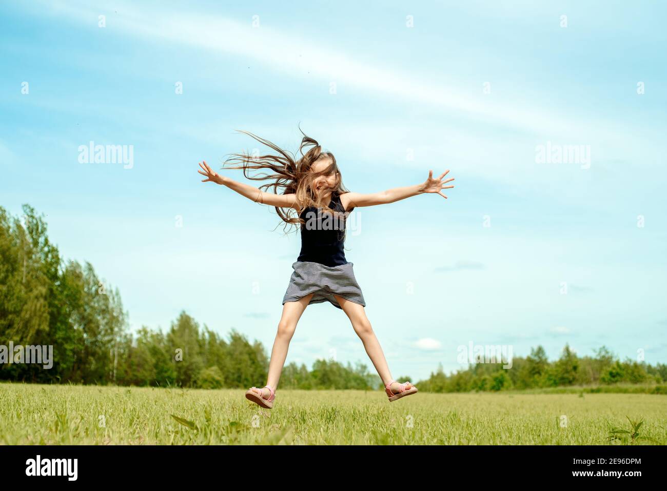 Child kid jumping outdoor grass jump hi-res stock photography and ...