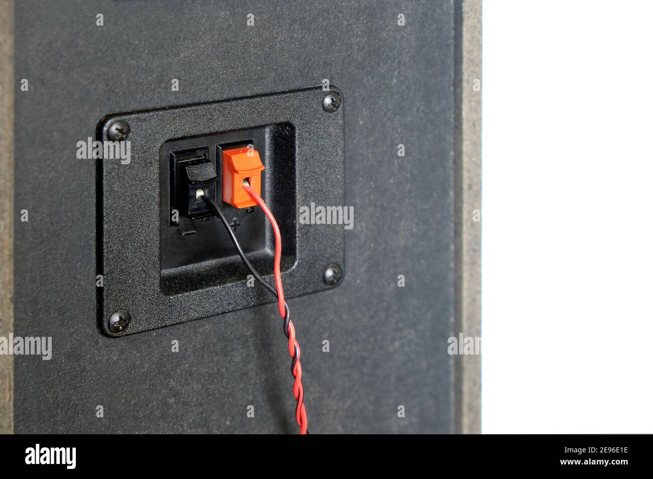 Red and black twisted wire connected to connection socket on rear side ...