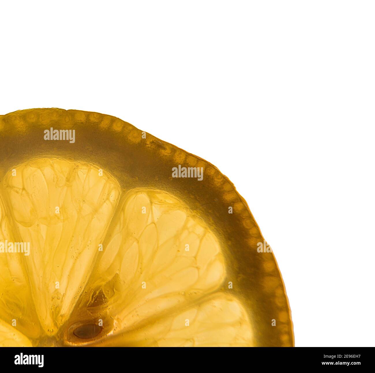 Detail quarter of a lemon slice backlit white isolated background ...