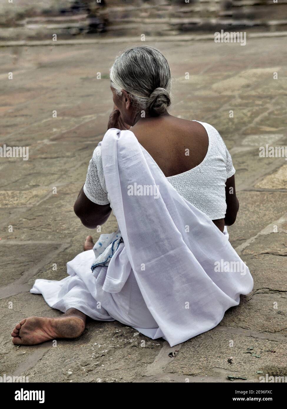 ANURADHAPURA, SRI LANKA - March 9, 2019: Old south asian barefoot women ...