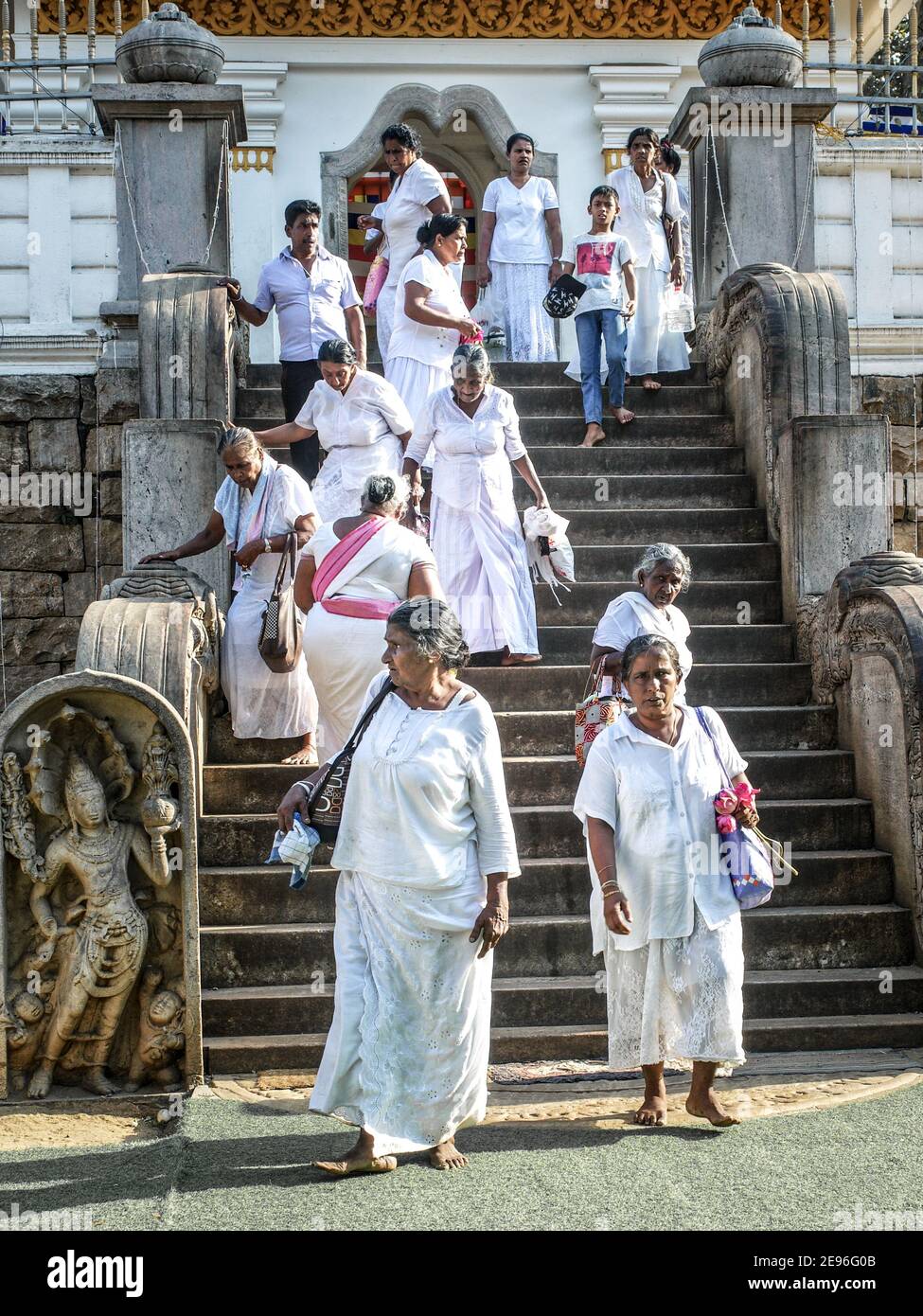 ANURADHAPURA, SRI LANKA - March 9, 2019: Group of women in white dress ...