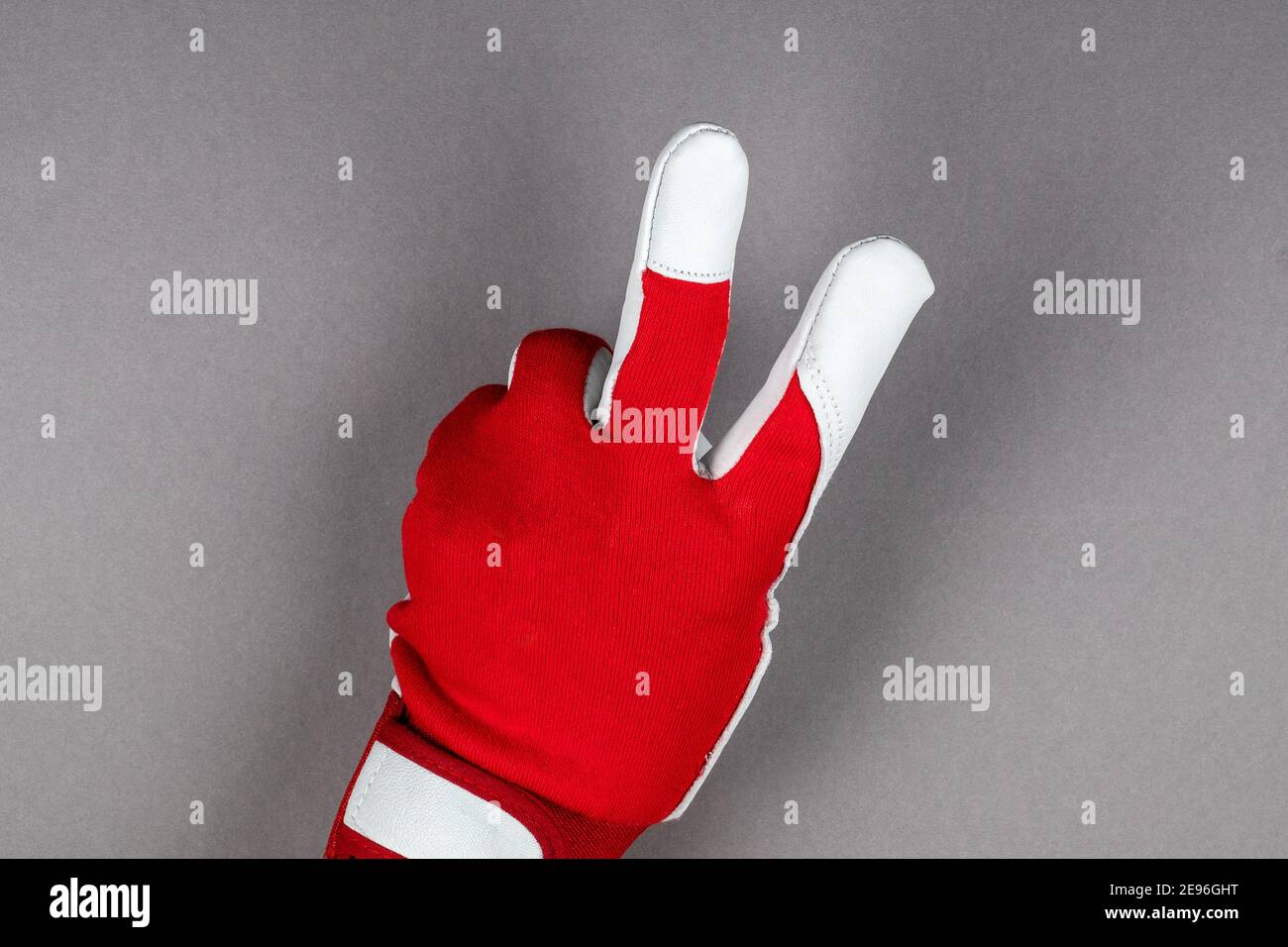 Man hand with leather work glove showing two fingers Stock Photo - Alamy