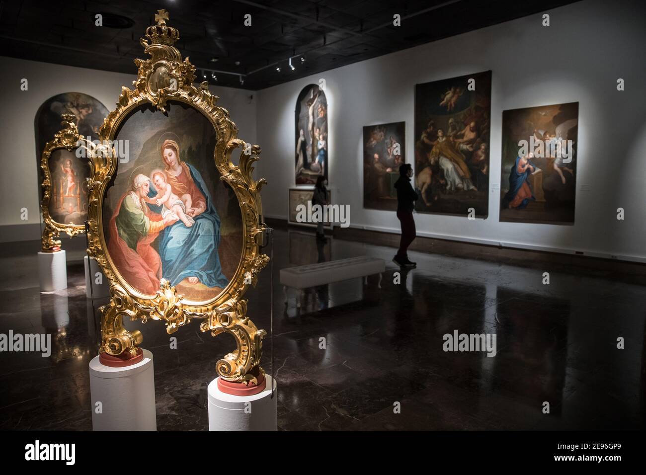 Visitors look at paintings in an exhibition of Szymon Czechowicz, a ...