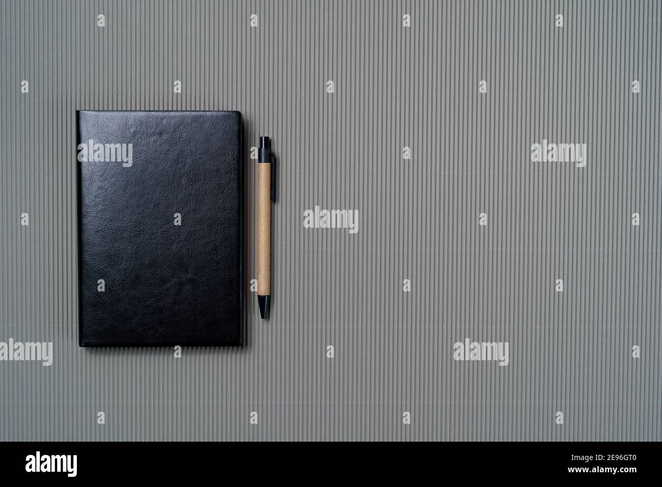 Black leather notebook on a paper gray background, notepad mock up, top ...