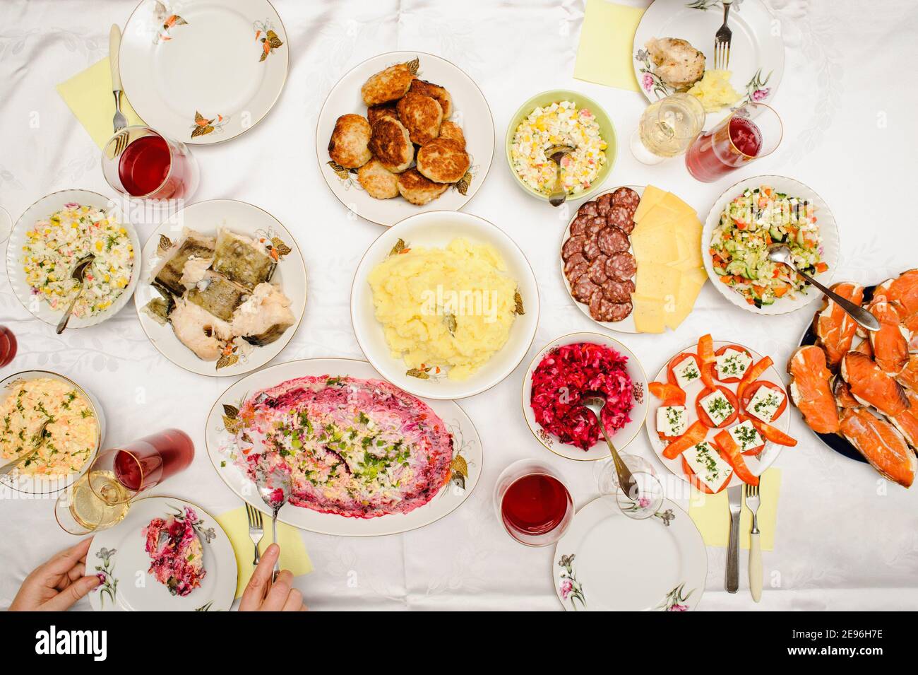 Flatlay of festive Soviet and Russian dinner on white background ...