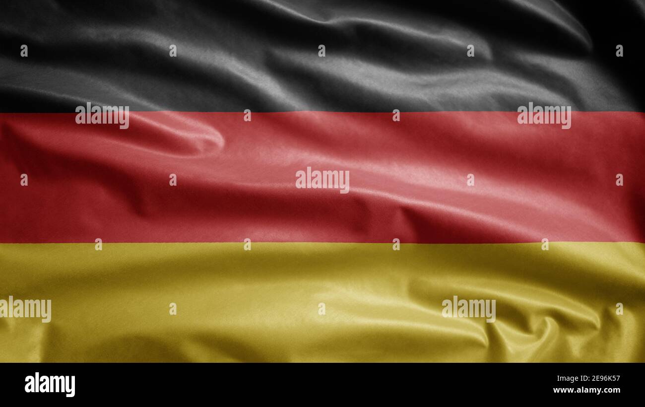 German flag waving in the wind. Close up of Germany banner blowing ...