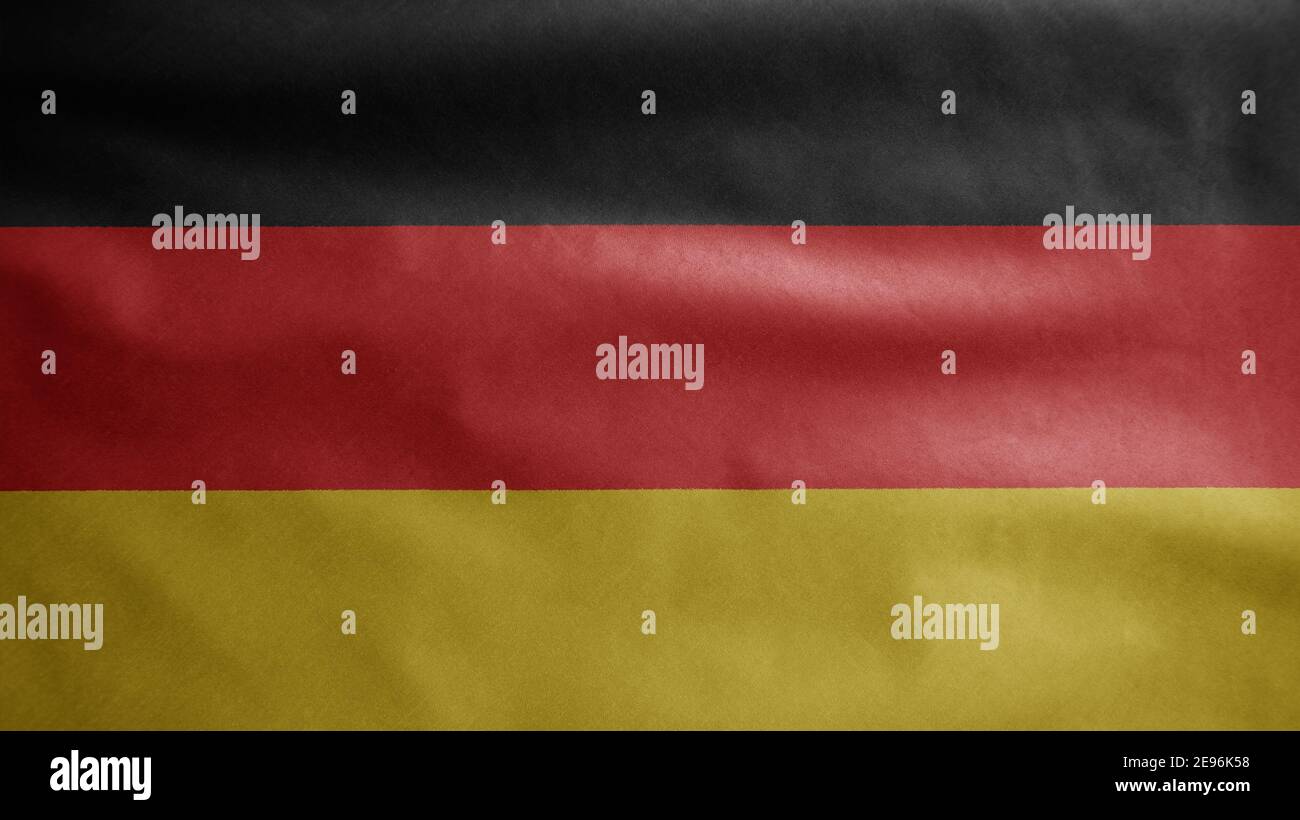 German flag waving in the wind. Close up of Germany banner blowing ...