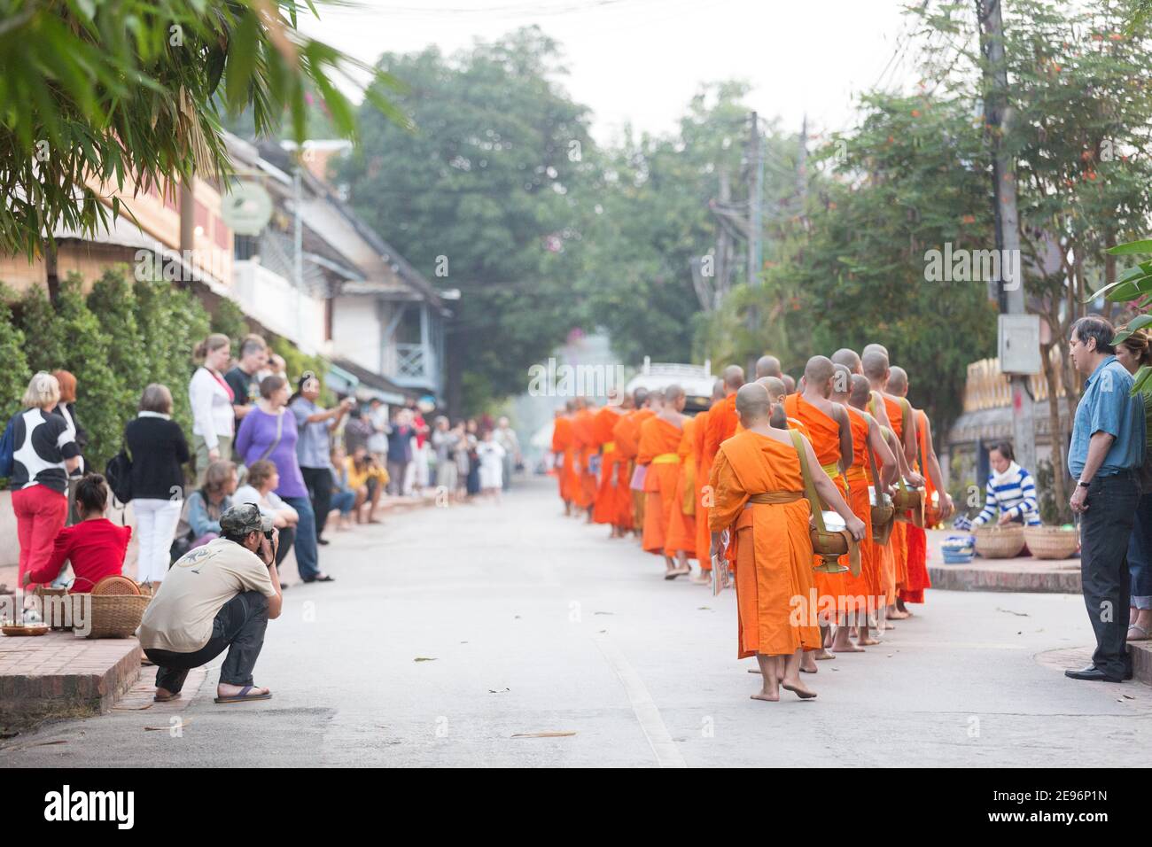Tak Bat or The monk's morning alms procession Stock Photo - Alamy