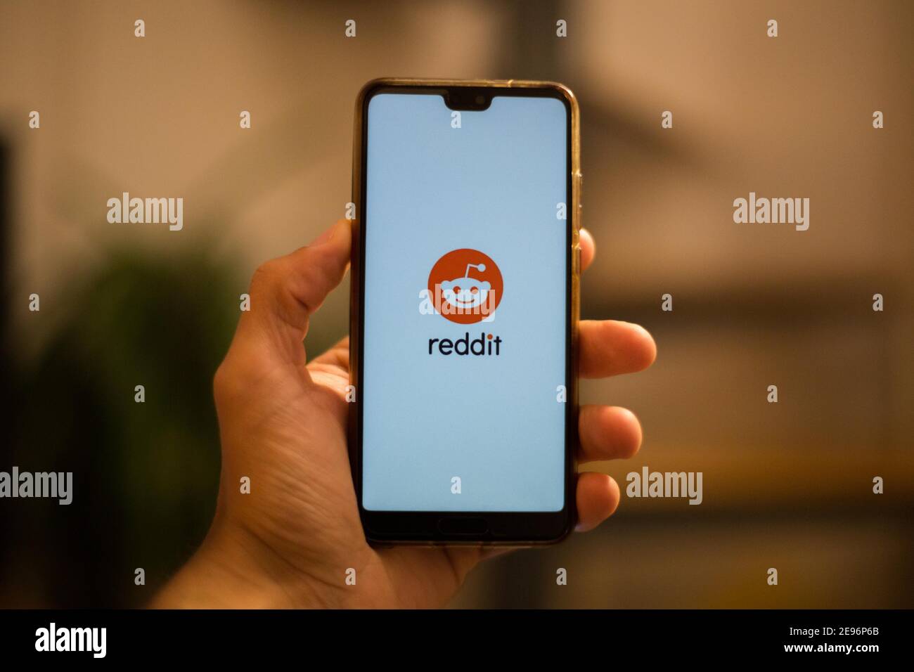In this photo illustration a Reddit logo is seen displayed on a ...