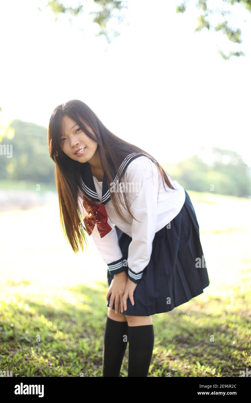 Asian school girl with countryside background Stock Photo - Alamy
