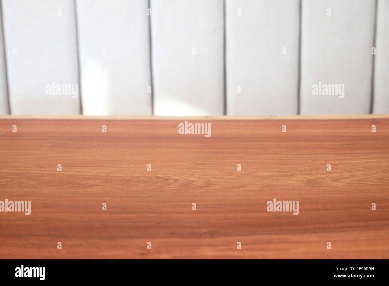 Desk table with long chair background in cafe Stock Photo - Alamy