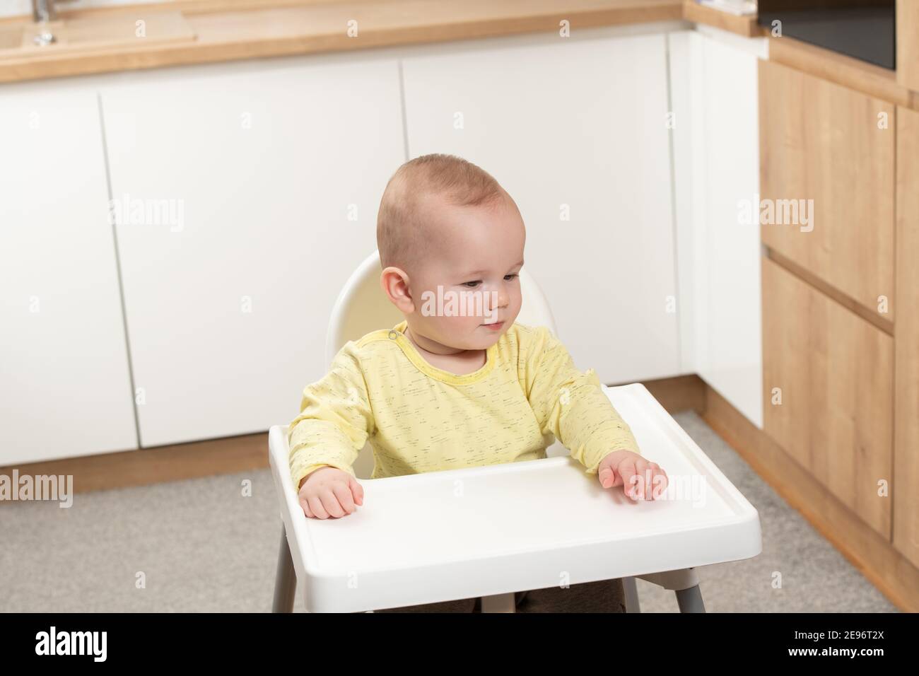 Little Baby Boy Sit on a Chair and Ready to Eat and Looking for Mom ...