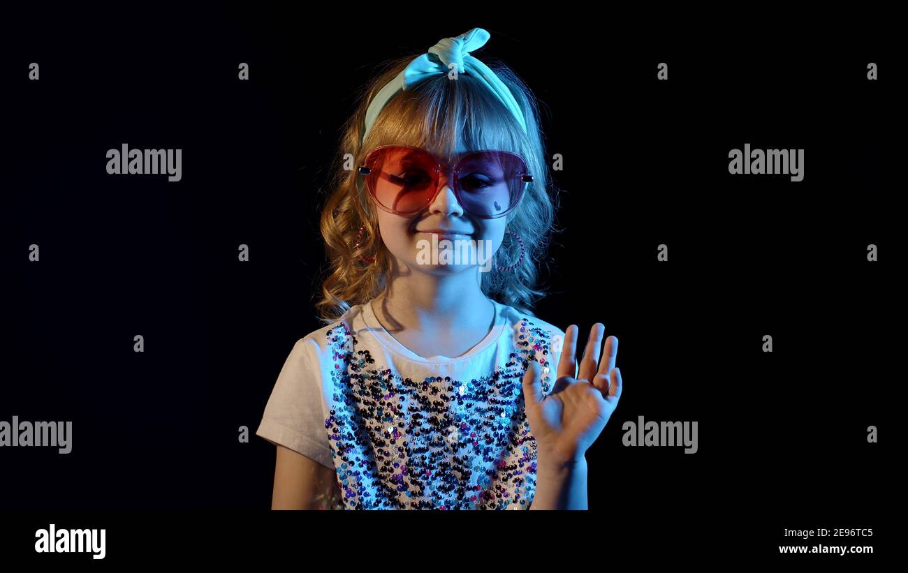 Futuristic hipster teen girl waving hand hello, hi, welcome, bye ...