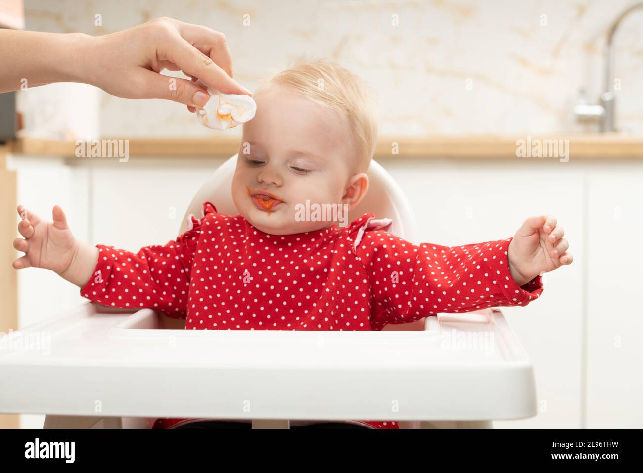 Babysitter feeding hi-res stock photography and images - Alamy