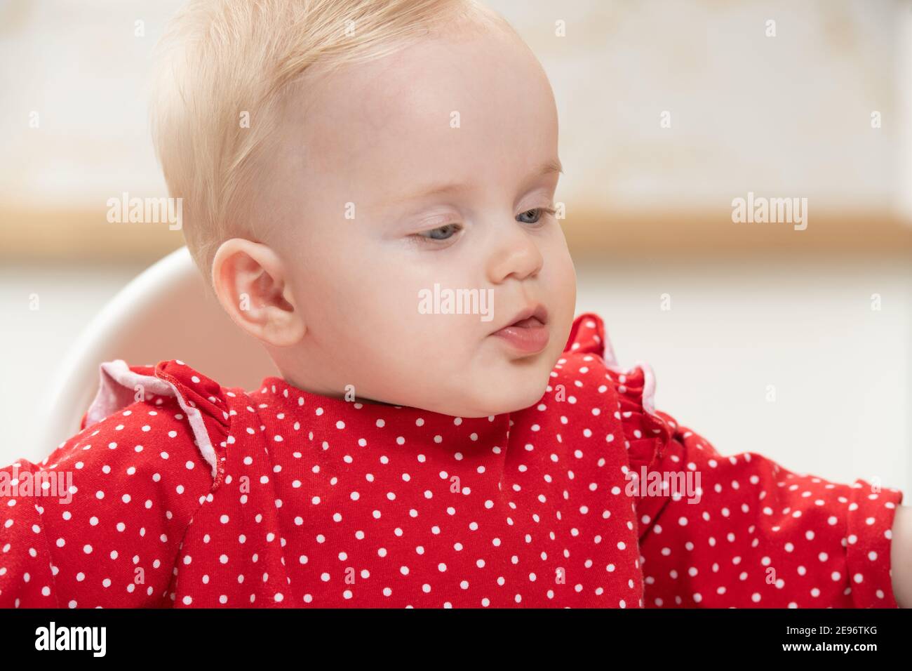 Mother Wipes Baby's Mouth With Napkin After Feeding Her Baby Daughter ...