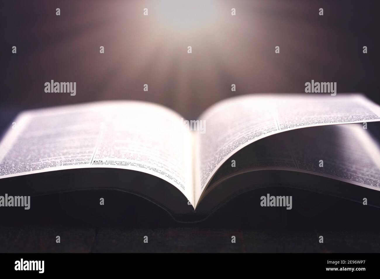 Bible Open on a Rustic Wooden Table with Pages Blowing Open Stock Photo ...