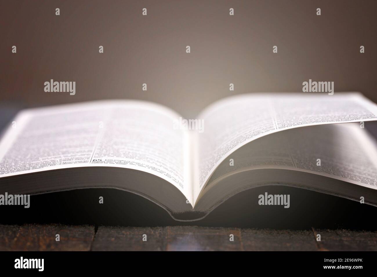 Bible Open on a Rustic Wooden Table with Pages Blowing Open Stock Photo ...