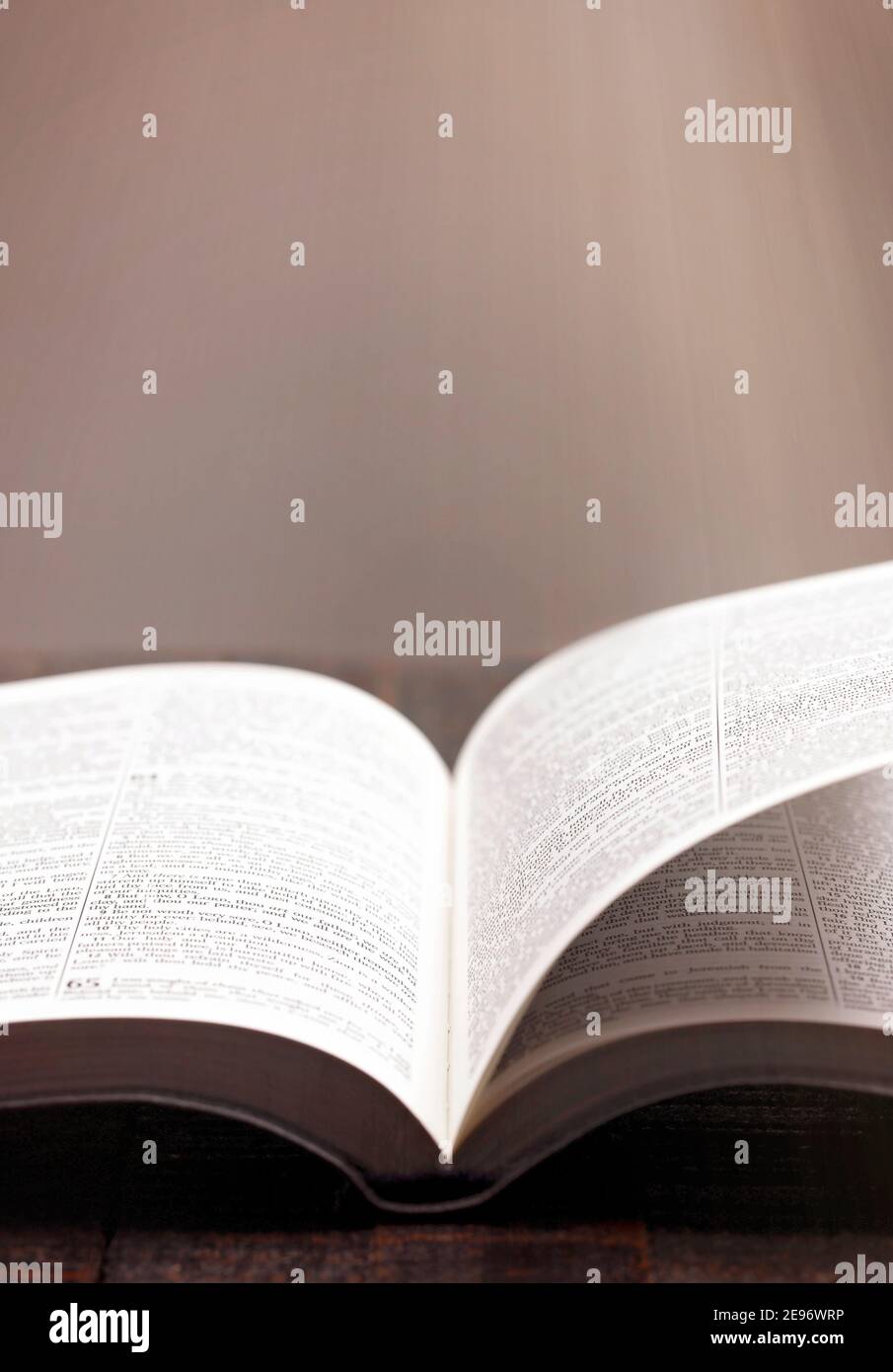 Bible Open on a Rustic Wooden Table with Pages Blowing Open Stock Photo ...