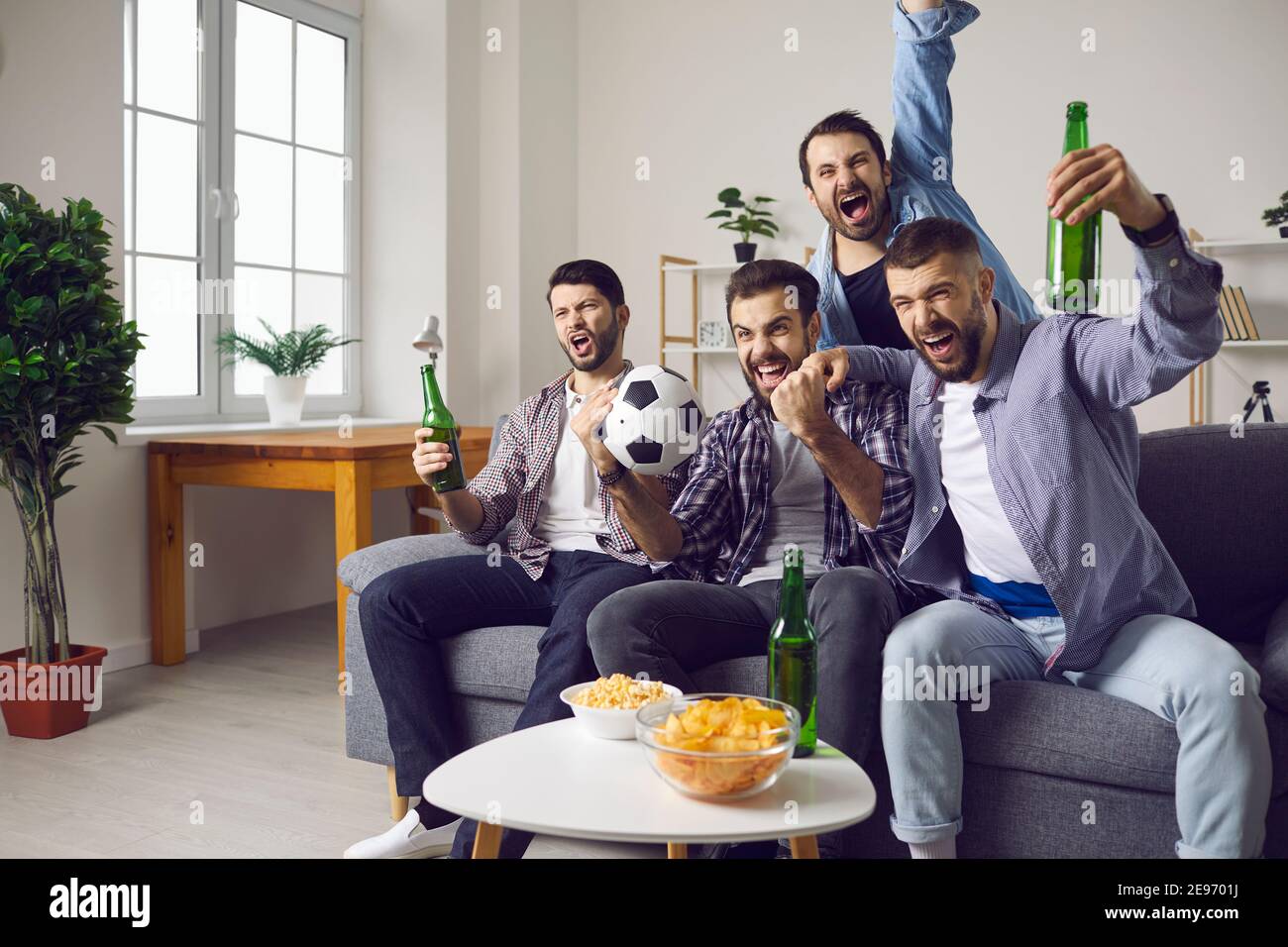 Group of excited men friends football fans feeling happy and ...