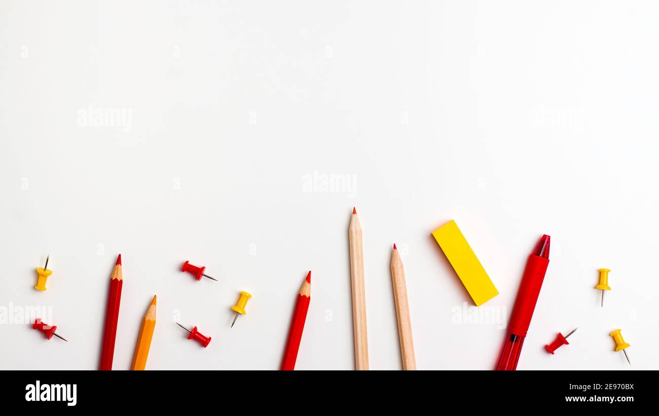 Red and yellow pen, sticky note, notepad, marker, eraser, push pins ...