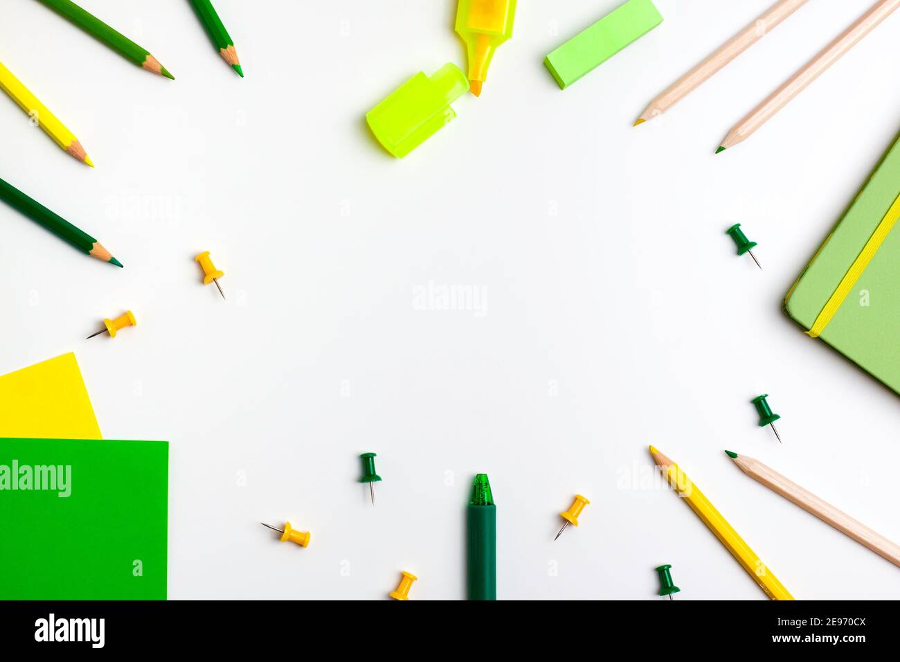 Green and yellow pen, sticky note, notepad, marker, eraser, push pins ...