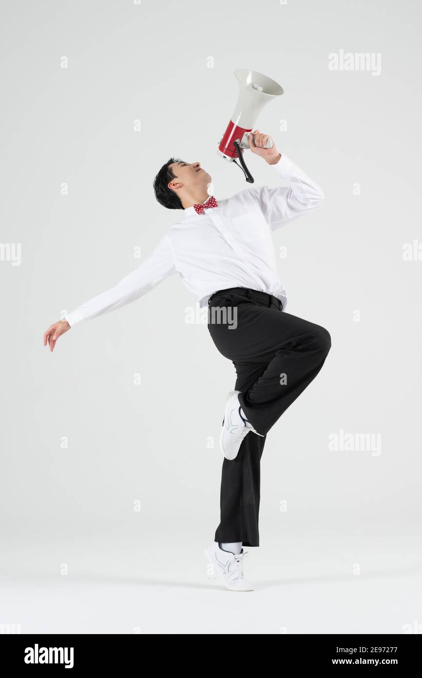 sale promotion concept, contemporary male dancer with megaphone Stock ...