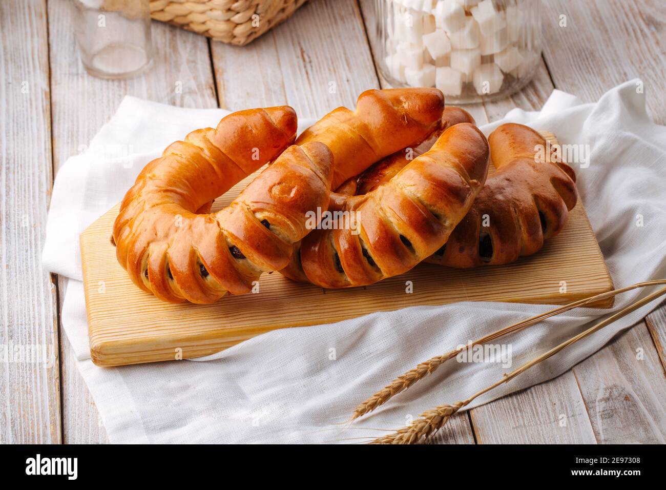 Side view on three fresh baked bagel buns Stock Photo - Alamy