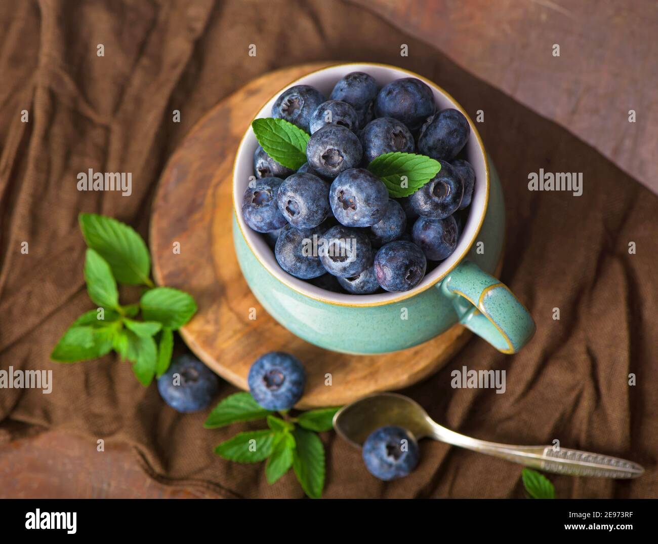 Fresh blueberry in a cup with leaves of mint Stock Photo - Alamy