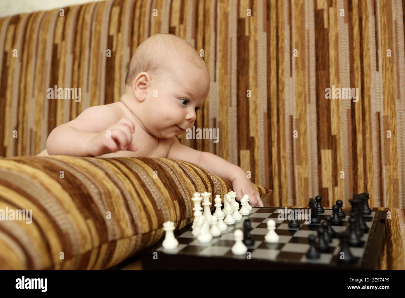 Baby boy playing chess hi-res stock photography and images - Alamy