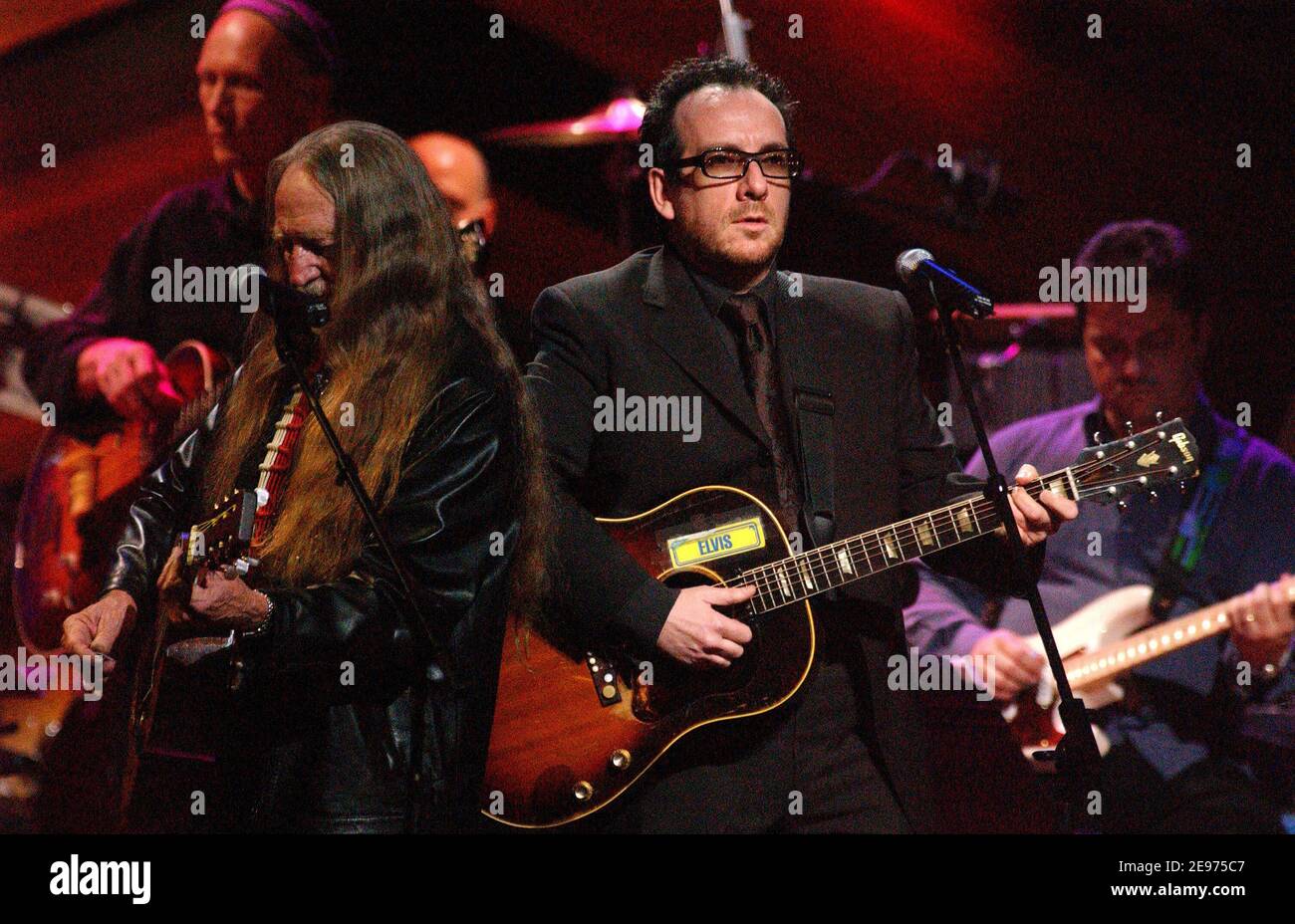 Elvis Costello and Willie Nelson performing during "Willie Nelson ...