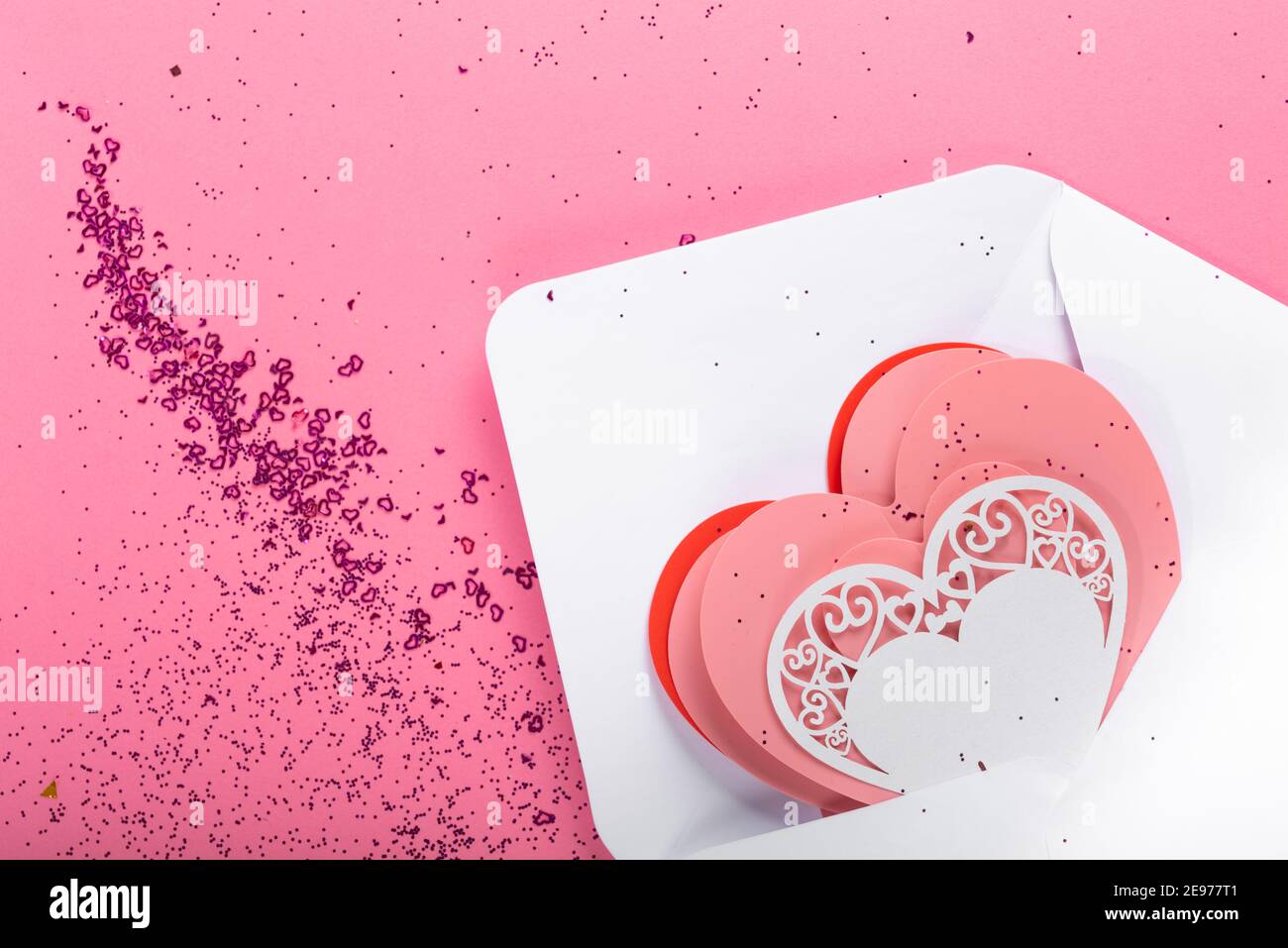 Handmade Love letter, envelope with paper craft hearts on background ...