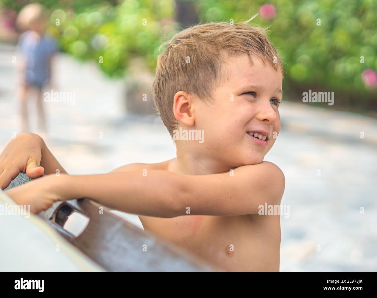 Side portrait mischievous boy, freckled nose, open mouth intriguing ...