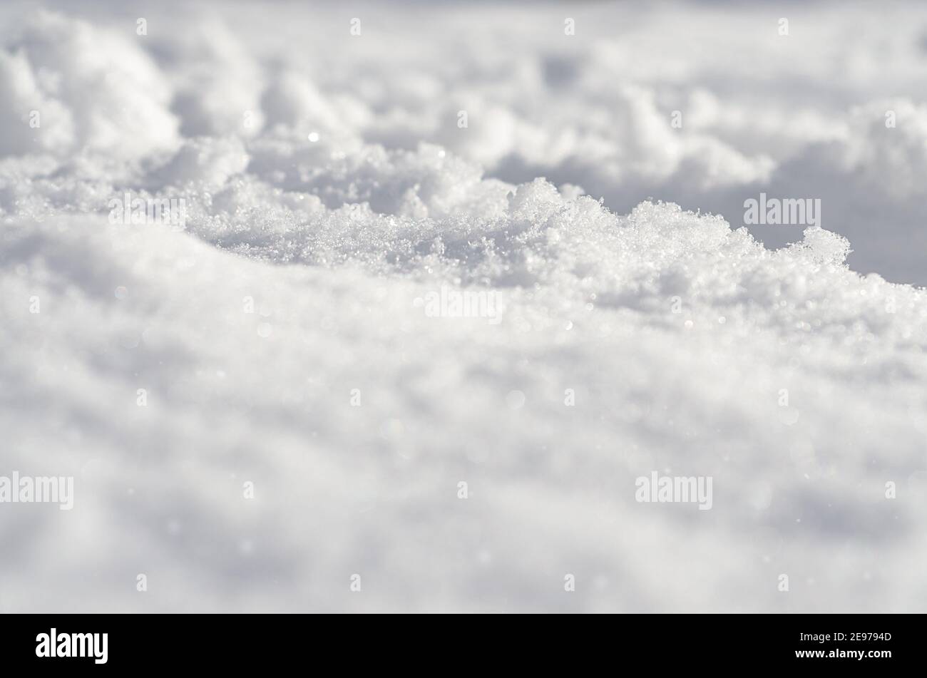 Abstract snowy ground. Winter landscape with hills covered with snow ...